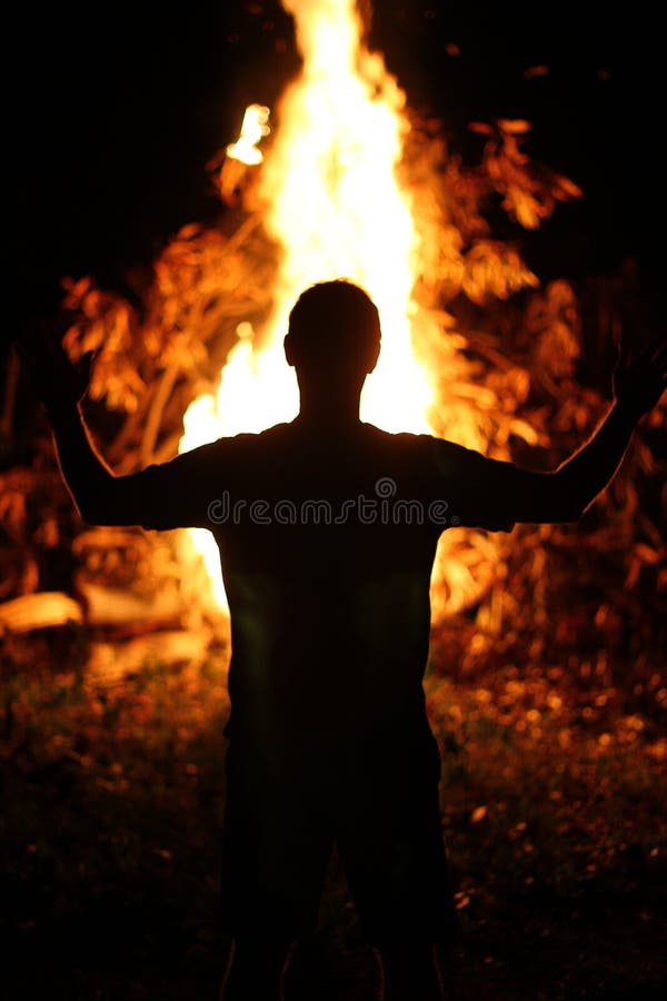 Man in Front of Fire stock image. Image of sillhouette - 57516171