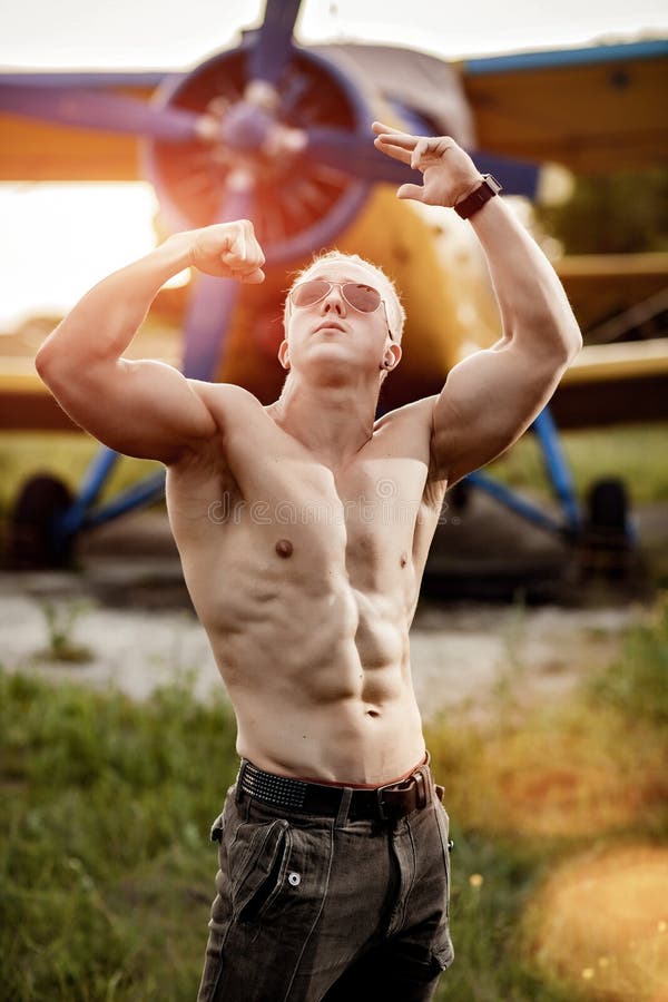 A man in front of a plane. stock photo. Image of fitness - 110134916