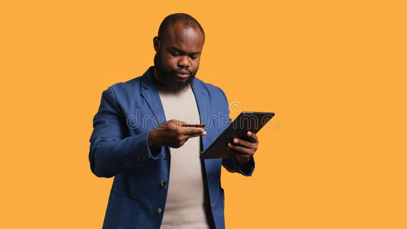 Man Frowning Seeing Insufficient Funds Error on Tablet, Studio ...