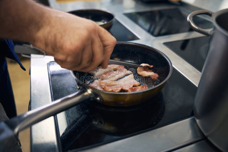 Man Frying Bacon in a Frying Pan Stock Image - Image of service, roast ...