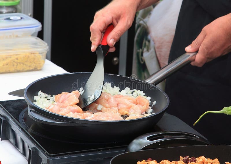 Man Frying Chicken and Onions Stock Photo - Image of chef, meat: 25947684