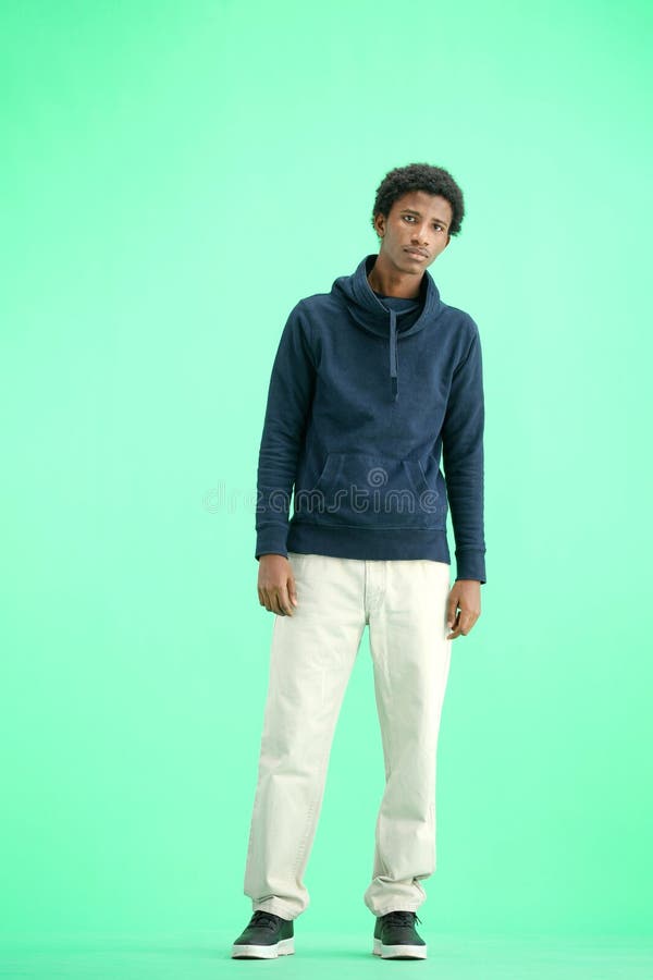 A Man, Full-length, on a Green Background Stock Image - Image of trendy ...