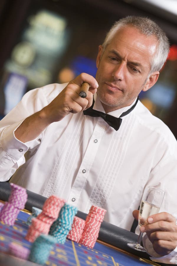 Man Gambling at Roulette Table Stock Image - Image of player, ethnicity ...