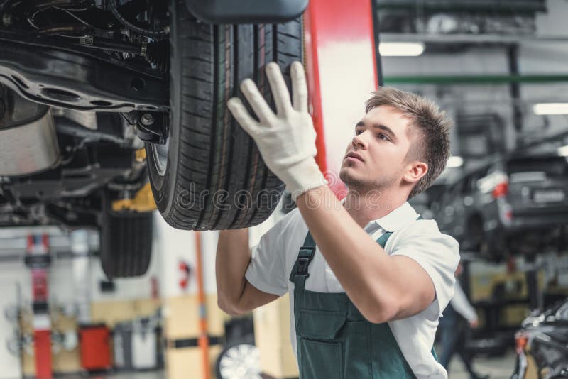 Man in garage stock image. Image of servicing, mechanic - 88586821