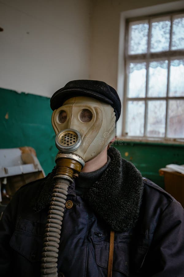 Man in Gas Mask in Abandoned Building Stock Photo - Image of respirator ...