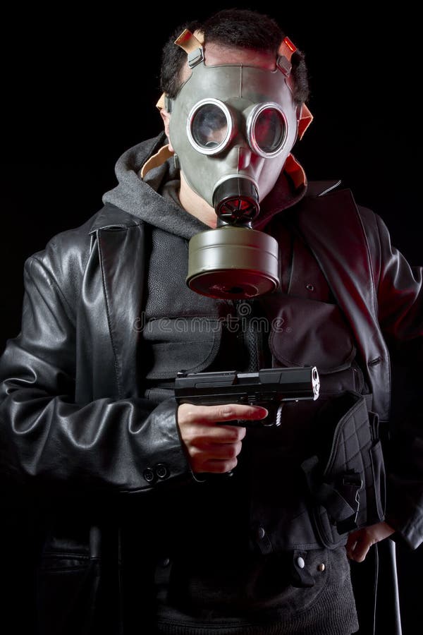 Man with gas mask and gun stock photo. Image of helmet - 27276992