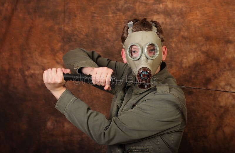 Man With Gas Mask And Katana Sword On Brown Batik Background Stock ...