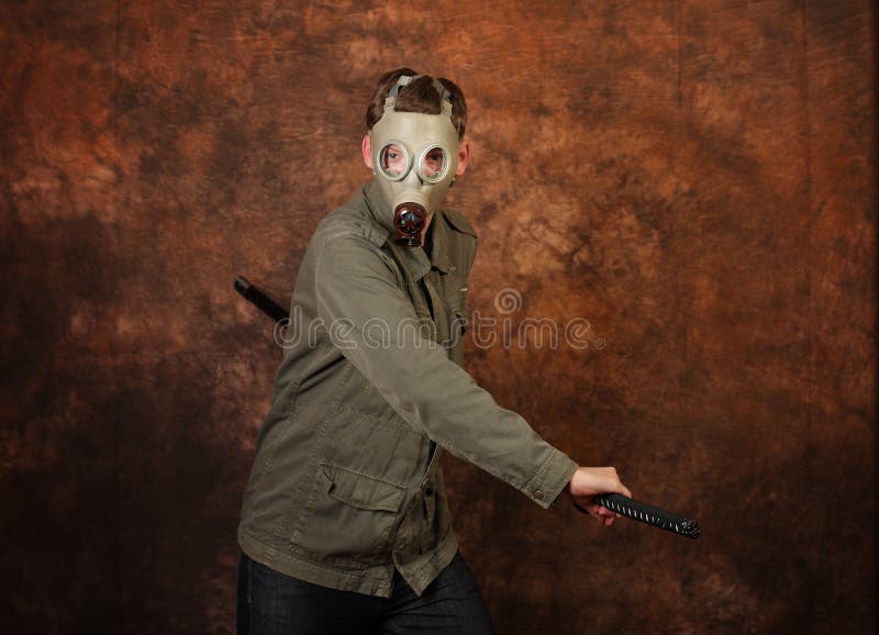 Man With Gas Mask And Katana Sword On Brown Batik Background Stock ...