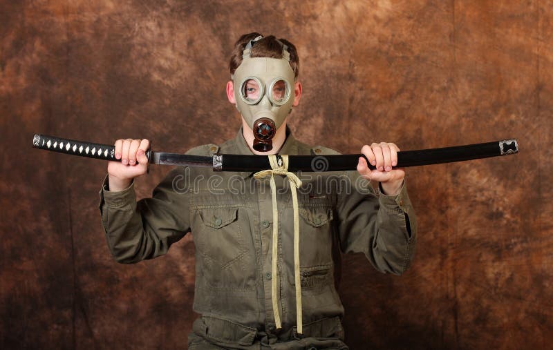 Man with Gas Mask and Katana Sword on Brown Batik Background Stock ...