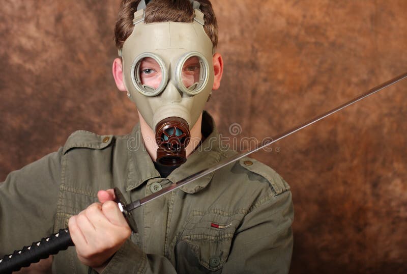 Man with Gas Mask and Katana Sword on Brown Batik Background Stock ...