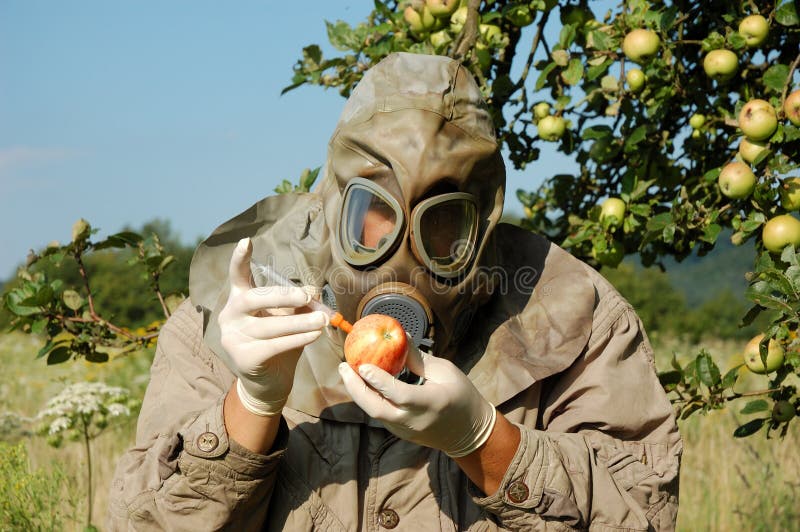 Man in Gas Mask Squirts Apple Stock Image - Image of contaminated ...