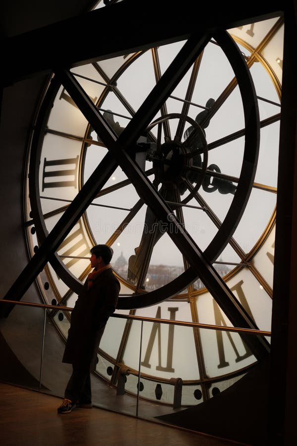 The Man is Looking at the Large Clock through the Windows Editorial ...
