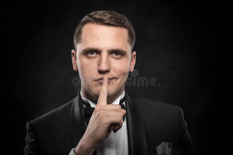 Man gesturing silent. stock photo. Image of portrait - 119170656