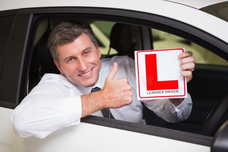 Man Gesturing Thumbs Up Holding a Learner Driver Sign Stock Image ...