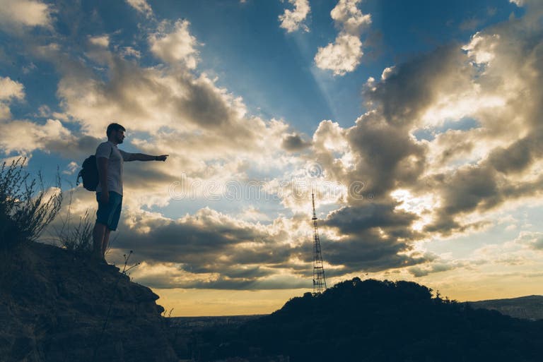 Man Get Top the Peak and Point on Something Stock Image - Image of ...