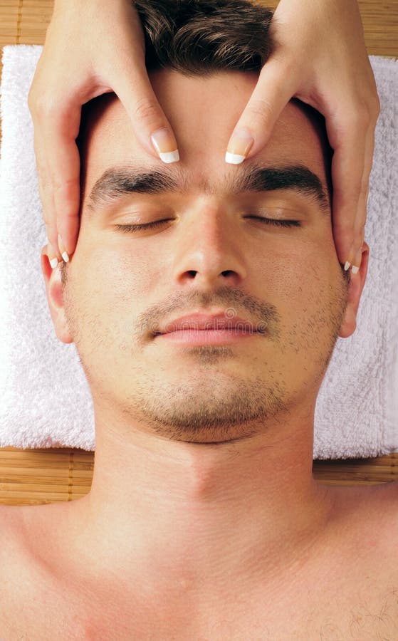 Man geting a face massage stock photo. Image of female - 20177344