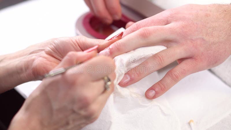 Man Gets Nails Manicure at Beauty Salon Stock Video - Video of ...