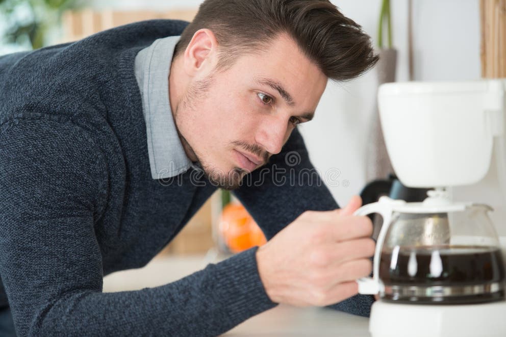 Man Getting Coffee Jug from Electric Filter Coffee Machine Stock Photo ...