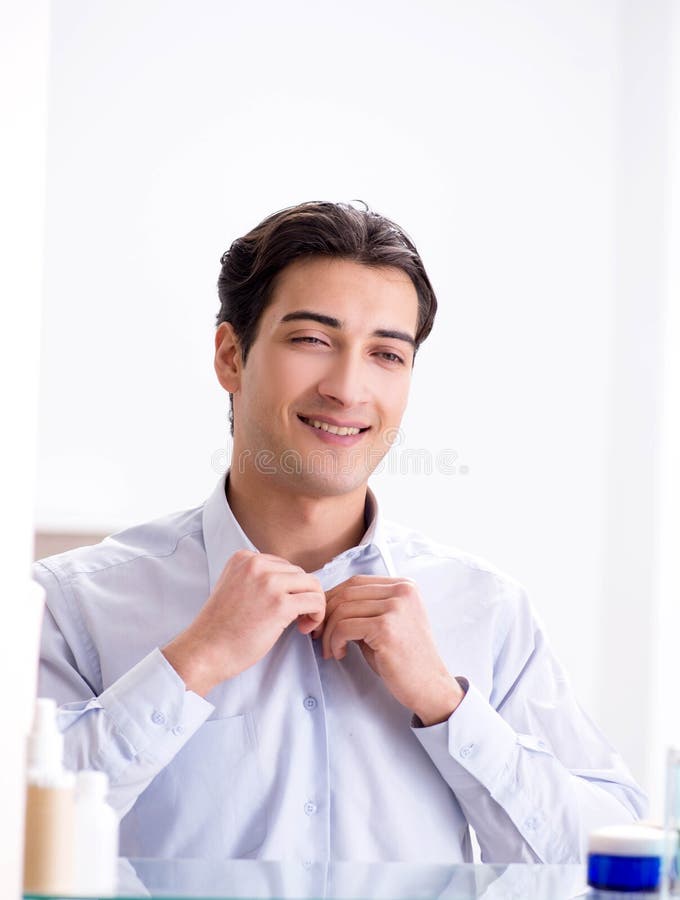 Man is Getting Dressed Up for Work in Bathroom Stock Photo - Image of ...