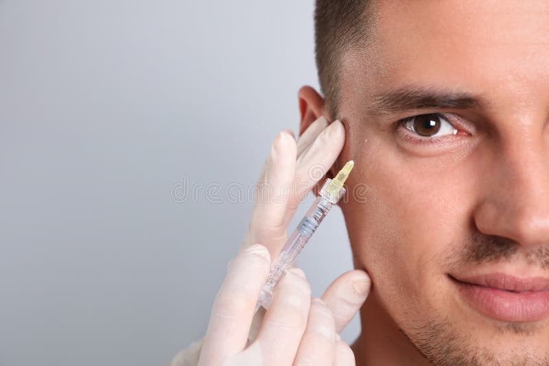 Man Getting Facial Injection on Grey , Closeup. Cosmetic Surgery Stock ... Man Getting Facial Injection on Grey , Closeup. Cosmetic Surgery Stock ...