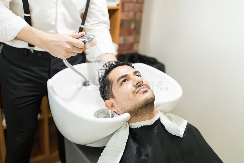 Man Getting His Hair Washed by Barber in Salon Stock Photo - Image of ...
