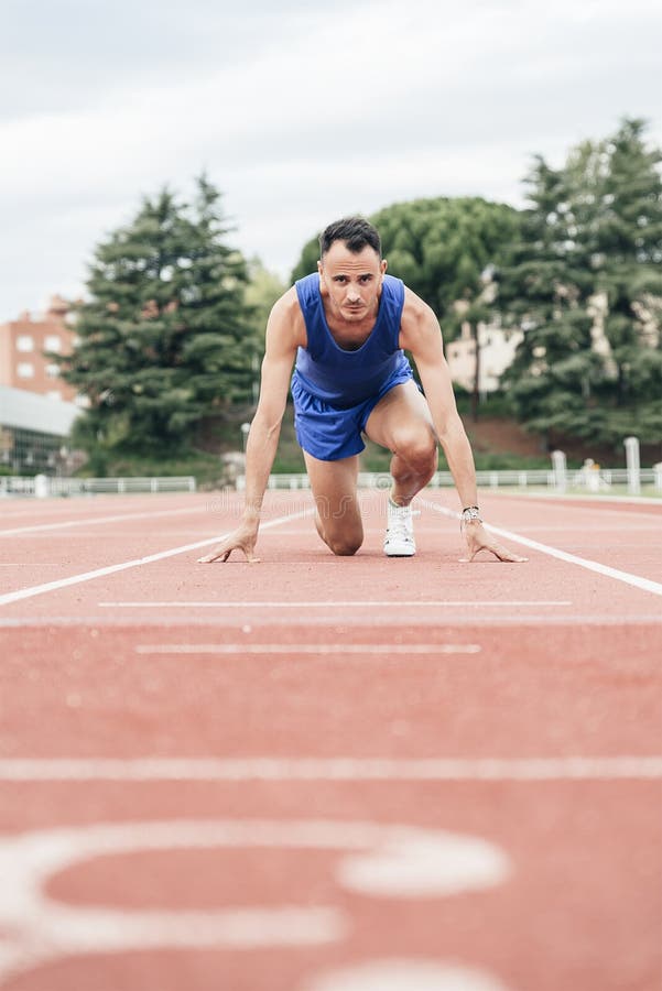 Man Getting Ready To Start Running. Stock Photo - Image of black, field ...