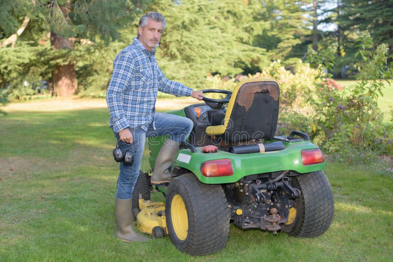 Man Getting on Ride on Mower Stock Image - Image of motor, grass: 115617401