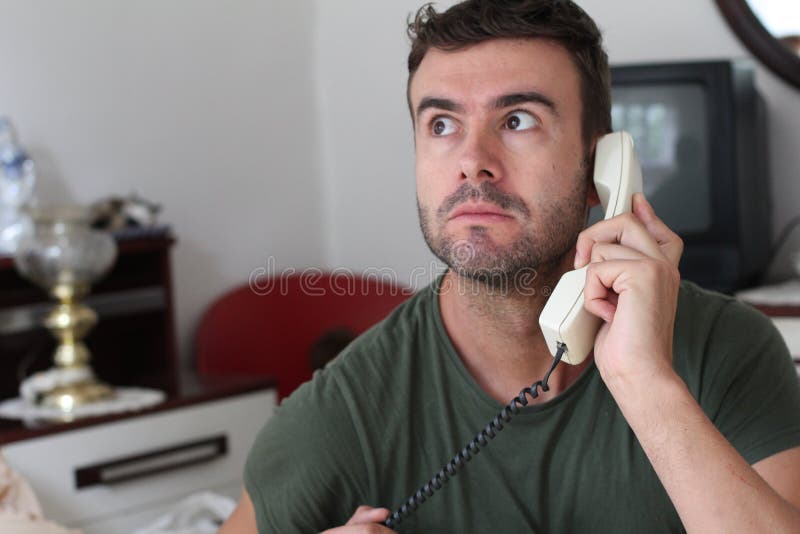 Man Getting Spooky News through Landline Telephone Stock Photo - Image ...