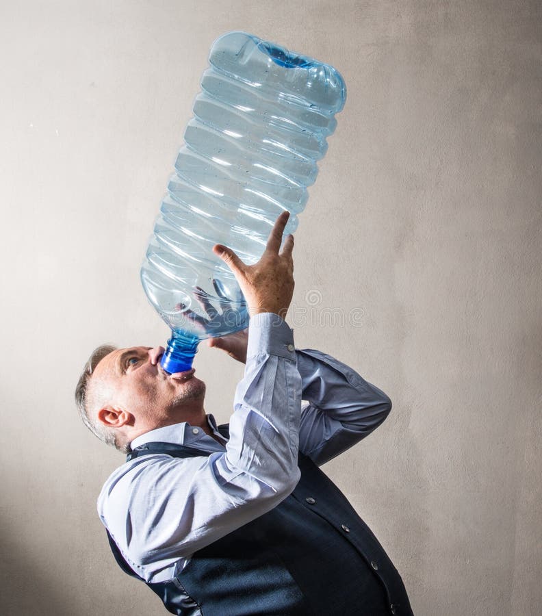 Man with a Giant Water Bottle Stock Image - Image of conceptual ...