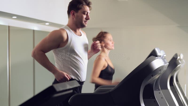 A Man and a Girl Running on the Treadmill Stock Video - Video of modern ...