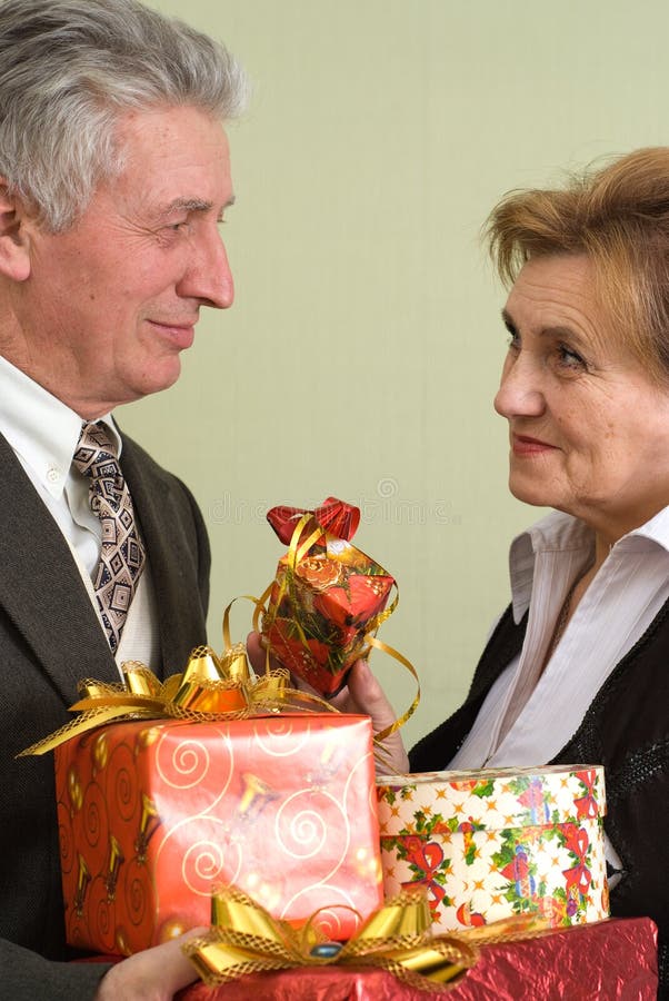 Man gives a woman gifts stock image. Image of manager - 13030833