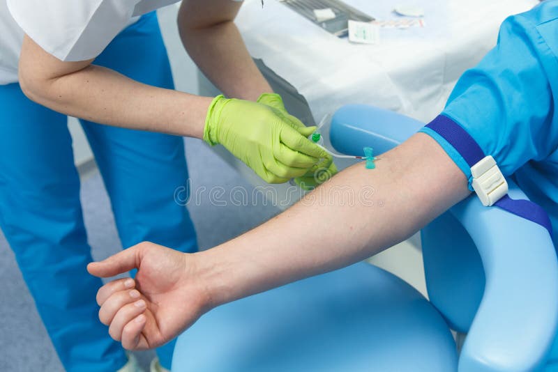 Man Giving Blood Donation with Syringe Stock Image - Image of inject ...