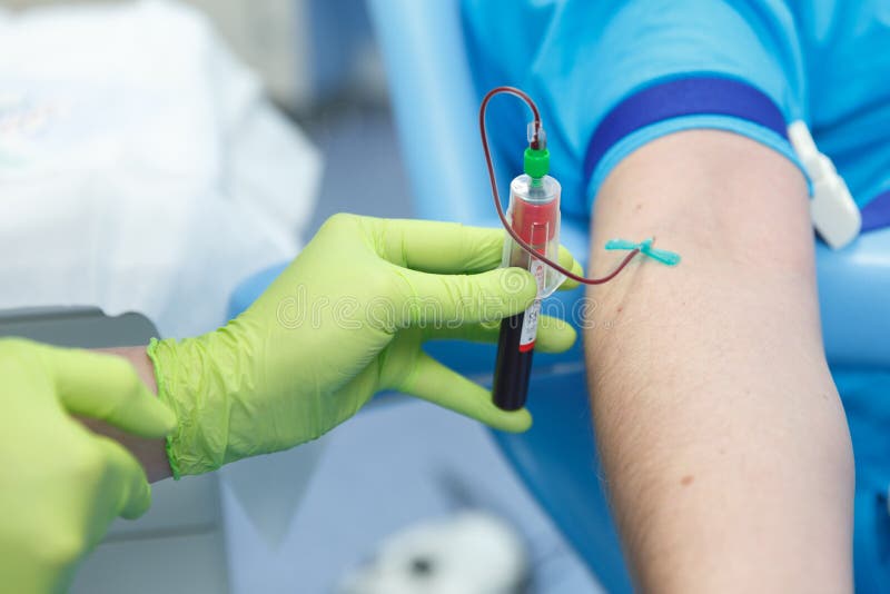 Man Giving Blood Donation with Syringe Stock Photo - Image of ...