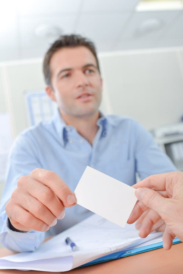 Man giving card in office stock image. Image of office - 124174031