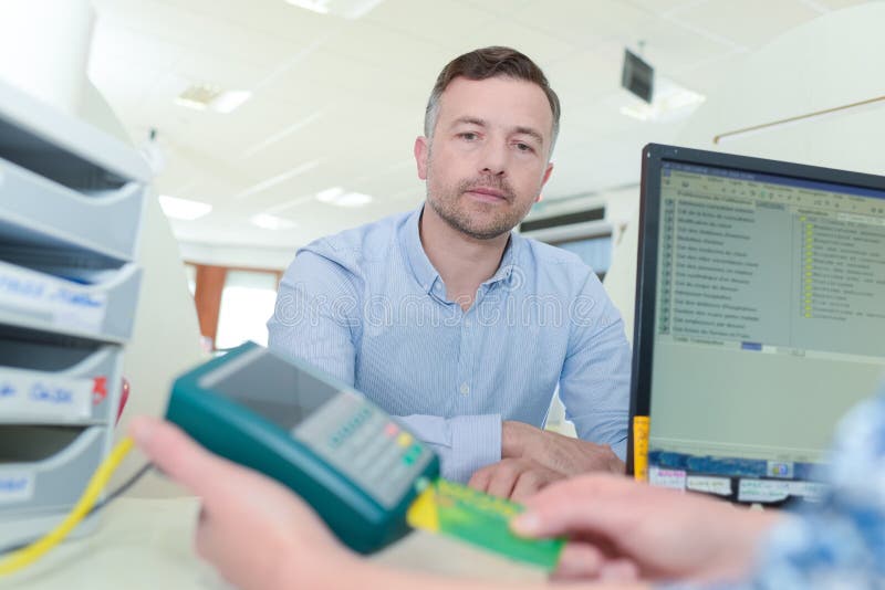 Man giving card to doctor stock photo. Image of giving - 239074904