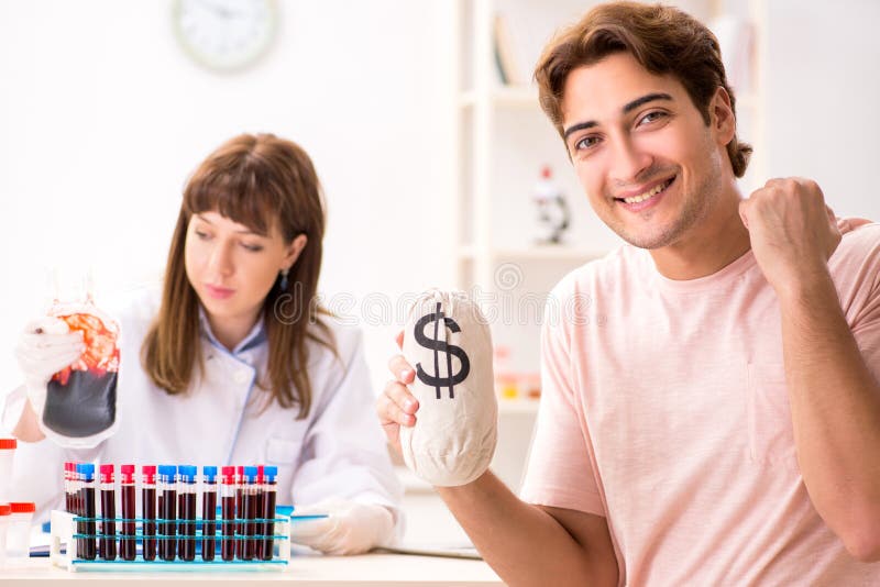The Man Giving His Blood As a Donor Stock Image - Image of care, clinic ...