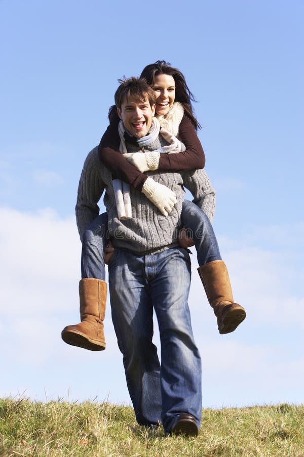 Man Giving His Wife a Piggy Back Ride Stock Photo - Image of people ...