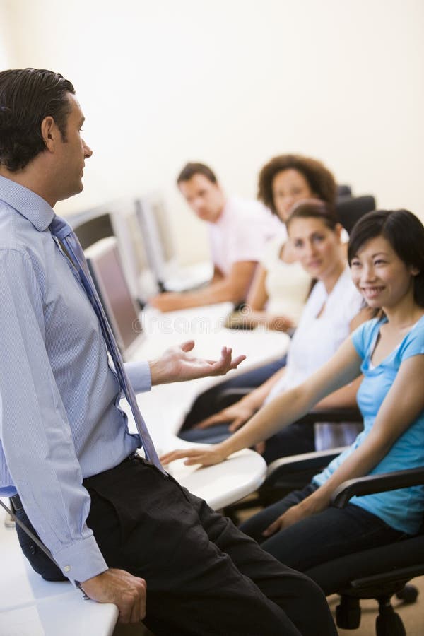 Man Giving Lecture in Computer Class Stock Image - Image of middle ...