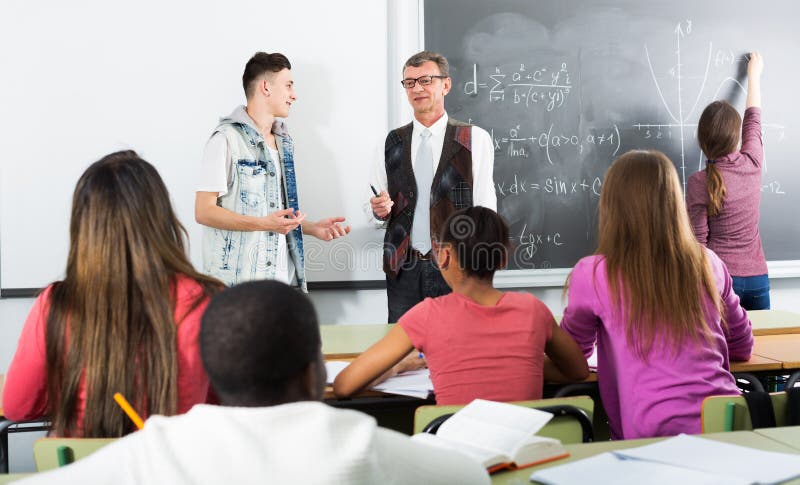 Man giving a math lesson stock image. Image of class - 179672113