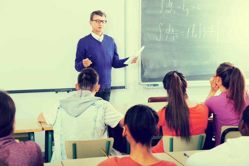 Man giving a math lesson stock image. Image of class - 179672113