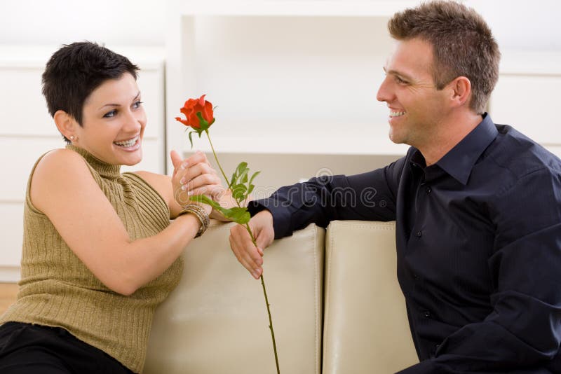 Man giving red rose stock photo. Image of furniture, clothing - 8339426