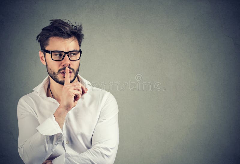 Man Giving a Shh Quiet Finger To Lips Gesture Stock Photo - Image of ...