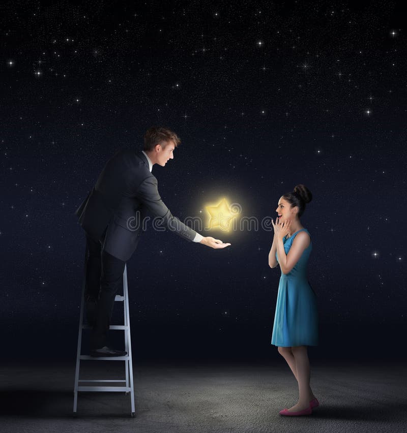 Man Giving a Star from the Sky To a Woman Stock Photo - Image of ...