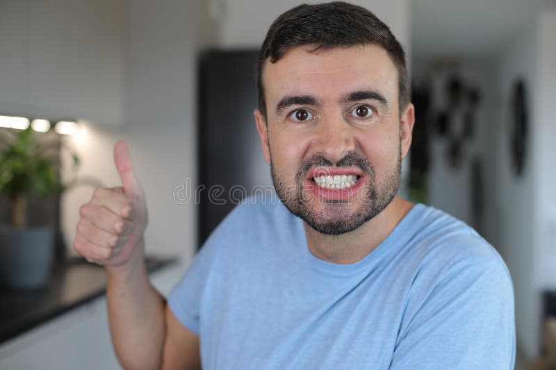 Man Giving a Thumbs Up Even Though he is Not really Sure about the ...