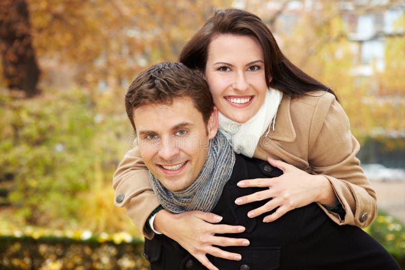 Man Giving Woman Piggyback Ride Stock Photo - Image of caucasian ...
