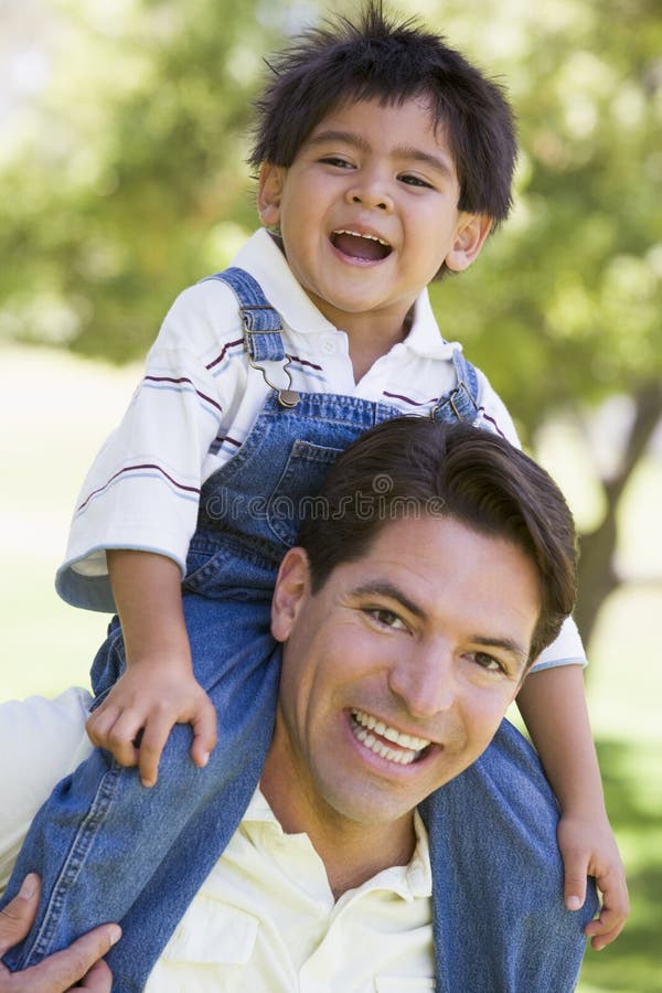 Man Giving Young Boy Shoulder Ride Smiling Stock Photo - Image of full ...