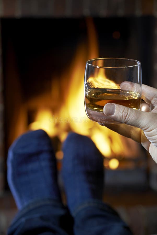 Man with Glass of Whisky Relaxing by Fire Stock Image - Image of home ...
