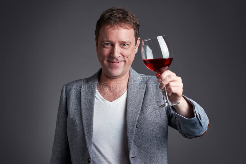 Man with glass of wine stock image. Image of adult, raise - 81729801