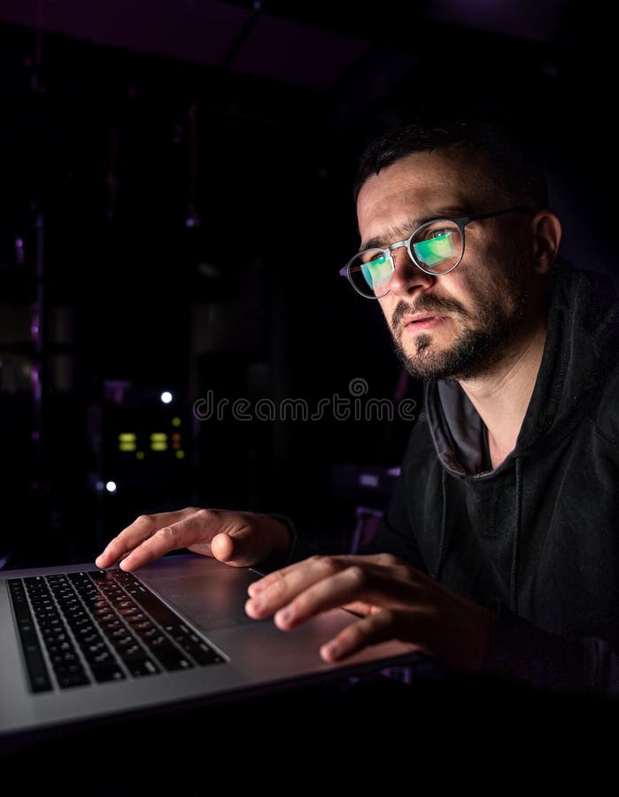 A Man with Glasses Works at a Computer Late at Night Editorial Stock ...