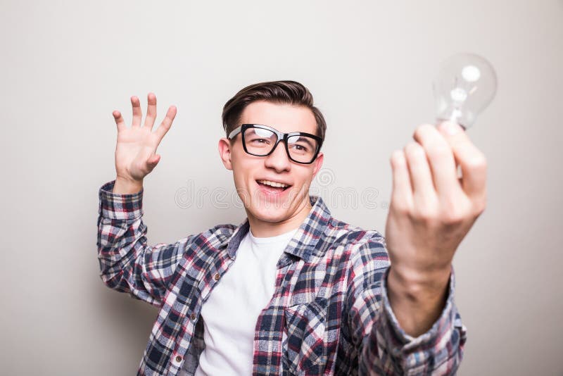 Man in Glasses Holding Small Light Bulb Stock Image - Image of joyful ...